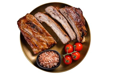 Chopped Bbq Pork Ribs On A Plate With Herbs Isolated On White