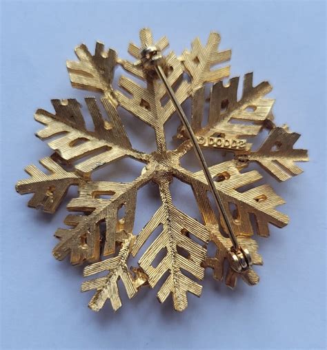 Vintage Dodds Gold Tone Snowflake Ice Blue Rhineston… Gem