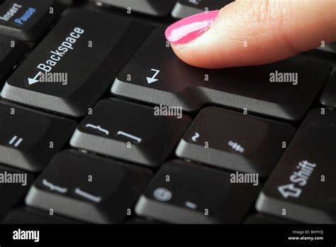Female Finger Pressing Computer Key Stock Photo Alamy