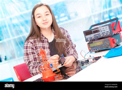 Schoolgirl In Laboratory Robots Debug Microcontroller Stock Photo Alamy