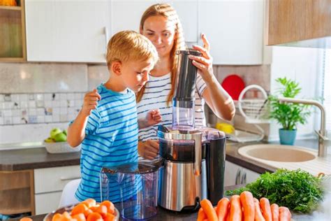 Premium Photo Portrait Of Siblings Playing In Kitchen