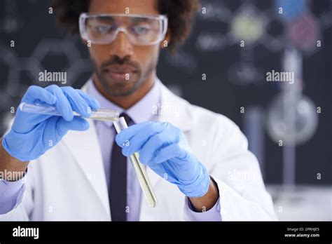Mixing Things Up A Male Scientist Conducting An Experiment In His Lab