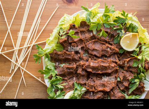 Turkish Food Cig Kofte With Lemon Lettuce And Parsley On Silver Tray