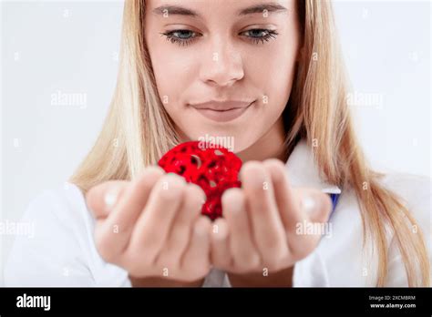Scientist Is Carefully Holding A Red Molecule Model In Her Hands Her