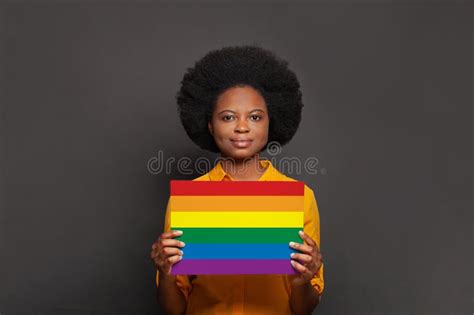 African American Woman Holding Lgbt On Black Background Stock Image