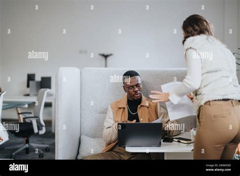 Multicultural Team Of Creative Business Professionals Strategizing And Brainstorming Ideas For