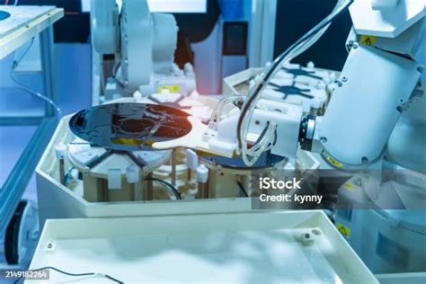 Automate Robot Arm With Silicon Wafers And Microcircuits And Automation System Control