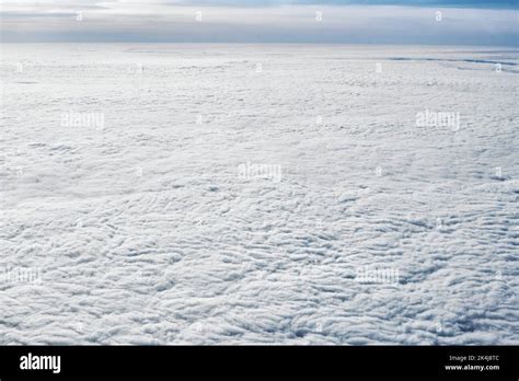 Over Clouds Top View From Aircraft Window Thick White Blue Clouds