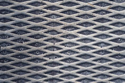 Graphic Background Of Diamond Shaped Pattern In Light And Dark Metal