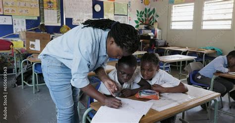 Close Up Black African Female Teacher Standing And Assisting African