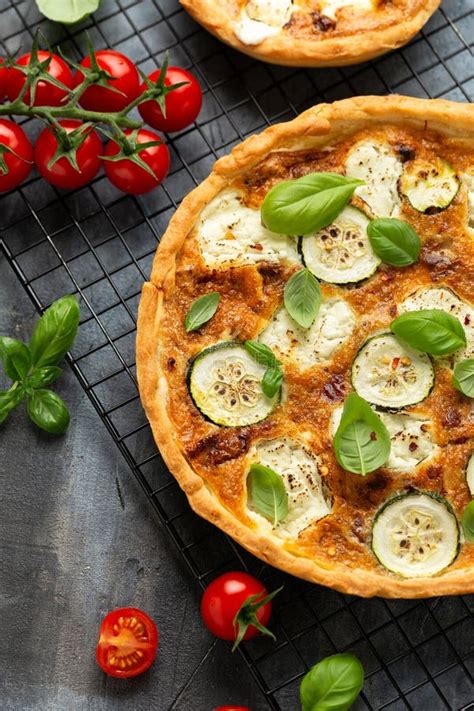 Sun Baked Tomato Goats Cheese And Courgette Quiche Served In Cast Iron