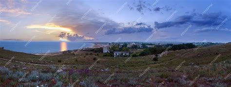 Premium Photo Sunlight Path On Sea Water Surface And Evening Town On