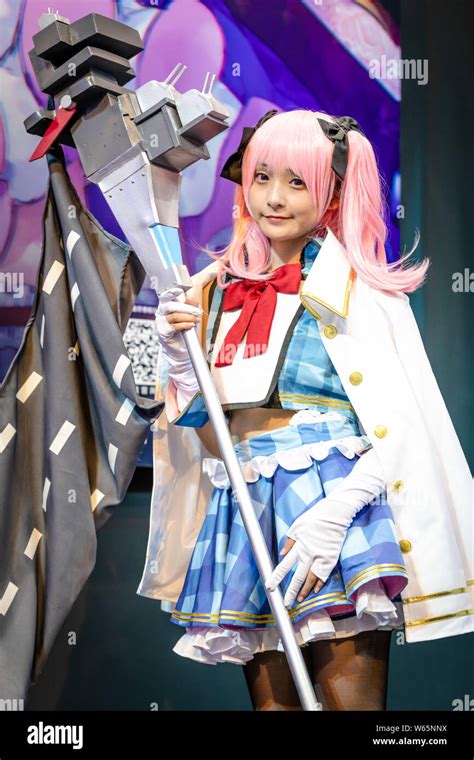 A Chinese Showgirl Dressed In Cosplay Costume Poses During The 16th