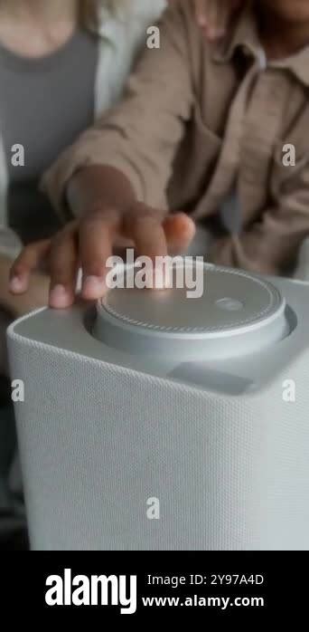 Medium Vertical Shot Of Smiling Caucasian Foster Mother Teaching African American Son To Use