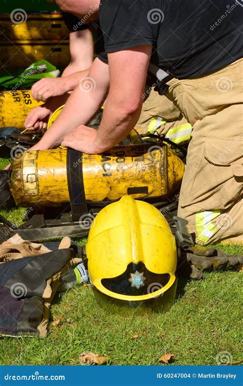 Firefighters Prepare Breathing Apparatus At Fire Scene Editorial Stock