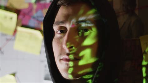 Free Stock Video Babe Male Hacker In Hood Looking At Camera With Binary Code Reflection On