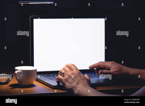 A Man Uses A Laptop At Night In A Dark Room Blank Laptop Screen In The Dark Stock Photo Alamy