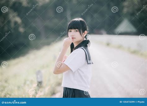 Portrait Of Asian Japanese School Girl Costume At Park Outdoor Film