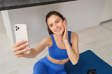 Free Photo Image Of Beautiful Atheltic Girl Sits On Yoga Mat At Home