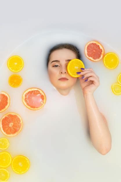 Premium Photo High Angle Portrait Of Girl By Fruits In Bathtub
