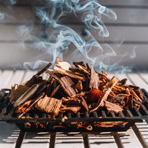 Smoking Wood Chips In A Smoker Tray Premium Ai Generated Image