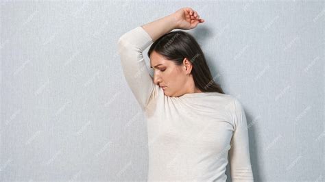Premium Photo Young Woman With A Sweat Problem Under Armpits The