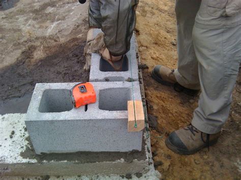 Aiki Homestead Laying Concrete Cinder Blocks