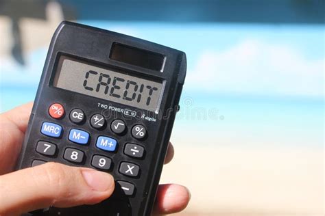 Credit Word On Calculator Display On Relaxed Beach Background Concept For Business And Finance