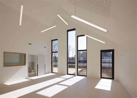 Brown Ceramic Shingles Cover Nomade Architects Village Like Nursery