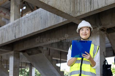 Asian Woman Engineer In Full Safety Gear Is Inspecting Inside The