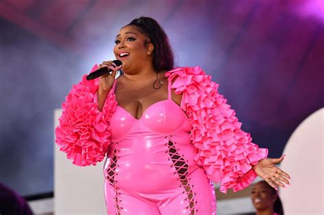 Lizzo Challenged Barbie To Top Her Hot Pink Lace Up Catsuit And Its