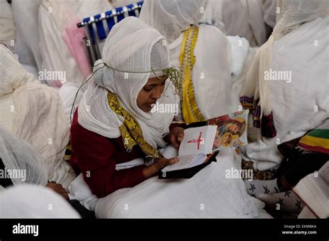An Ethiopian Orthodox Christian Pilgrim Reading The Bible In Amharic
