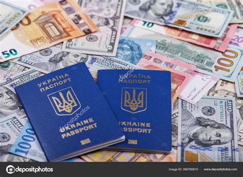 Two Ukrainian Biometric Passports Lie Background Currencies Different