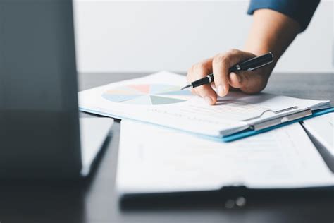 Premium Photo Business Data Analysis On Laptop Financial Charts Graphs Reports For Successful