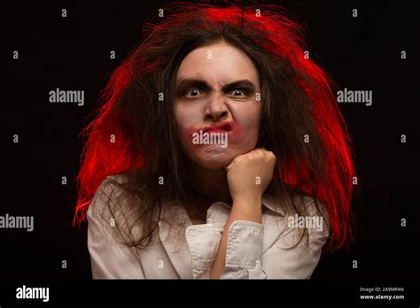 Fun Crazy Young Woman With Fluffy Hair On Black Background Make Shy