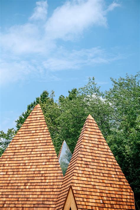 Wooden Shingles Overlay Monolithic Cabins On Chinese Waterfront