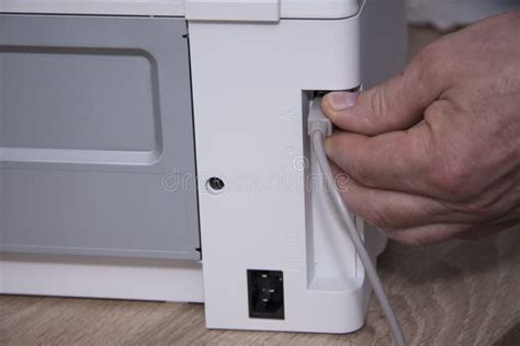 Connect The Device To The Local Network Male Hands Connect A Wire To A Multifunction Device