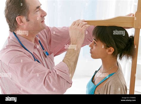 MEASURING HEIGHT ADOLESCENT Stock Photo Alamy