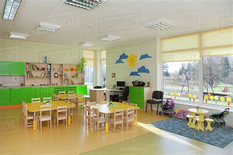 Classroom Activity Room With Furniture Tables And Chairs Stock