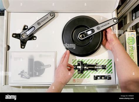 An Employee Of Pendix Gmbh Packs A Bottom Bracket Motor For The