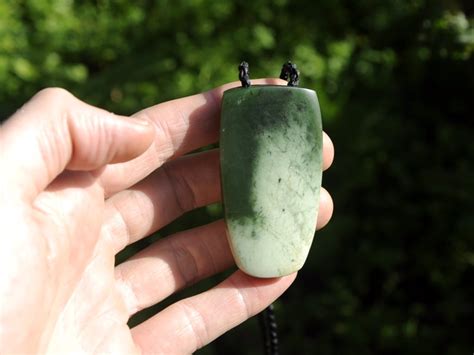 Pounamu Ruru White Flower — A Carved Piece