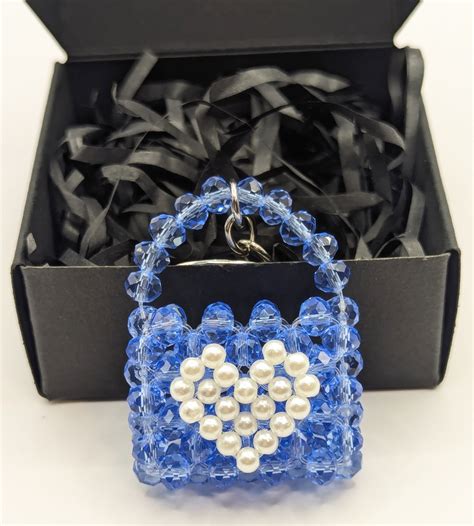 ბართი ბრელოკი ცისფერი ჩანთა თეთრი მარგალიტის გულით Veli Store