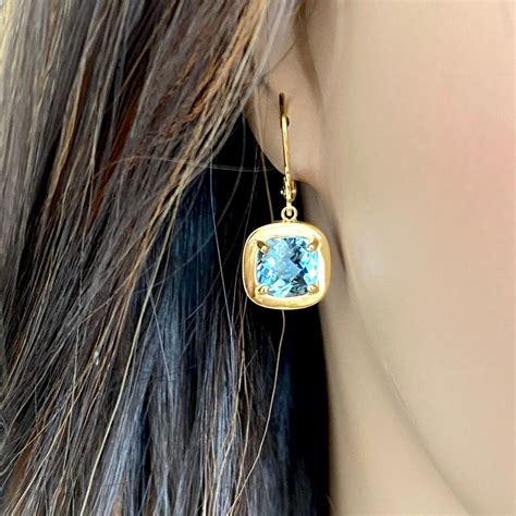 Cushion Shaped Aquamarine Bezel Set Yellow Gold Lever Back Drop