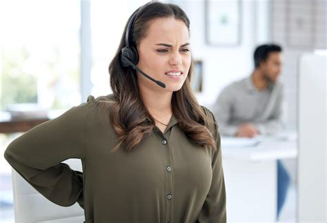Premium Photo Call Center Back Pain And Woman Agent Or Consultant On