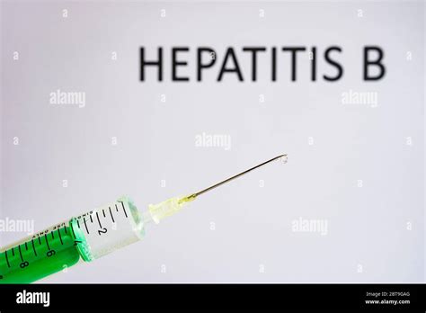 This Photo Illustration Shows A Disposable Syringe With Hypodermic