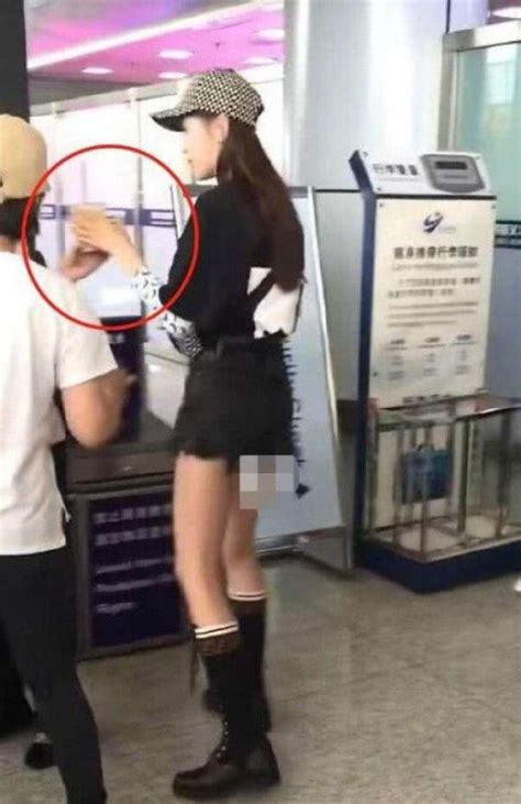 吳宣儀現身機場，沒喝完的奶茶被阿姨強行收走，留她本人尷尬微笑 每日頭條