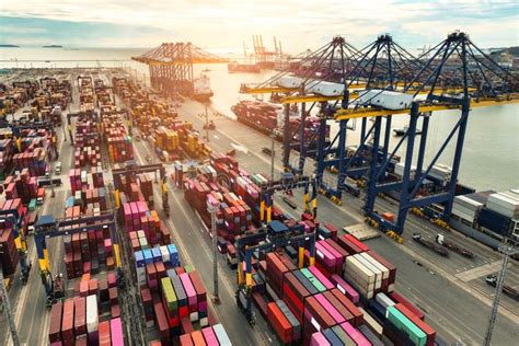 Container Ship Docked At Port With Cargo Trucks And Cranes Global Logistics Hub Maritime