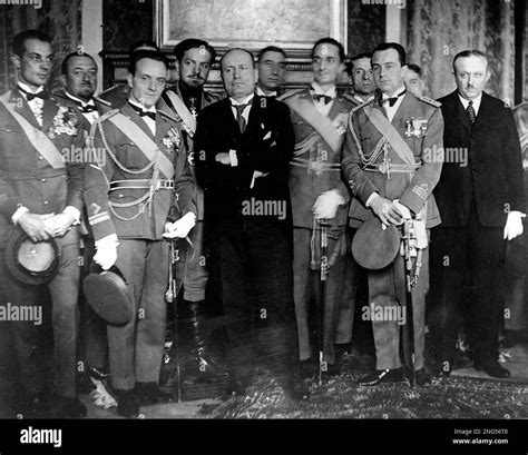 Italian Dictator And Prime Minister Benito Mussolini Centre With Arms