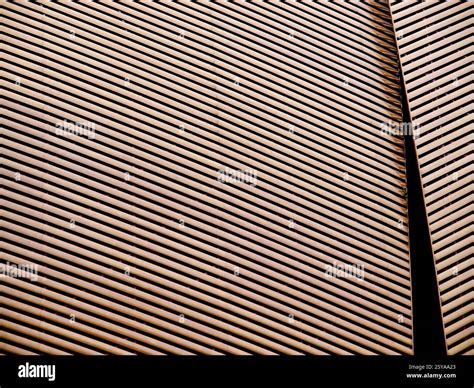 Modern Brown Slanted Strip Facade Pattern Of A Building Cladding Stock