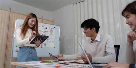 Ux Developer And Ui Designer Presenting Mobile App Interface Design On